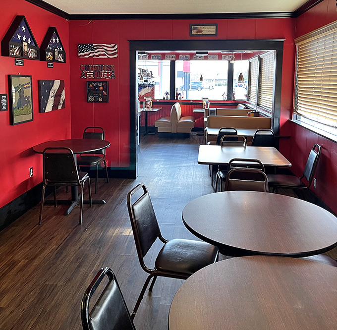 The dining area's patriotic red walls and wooden floors create that perfect "come as you are" vibe where both bikers and bankers feel equally at home.