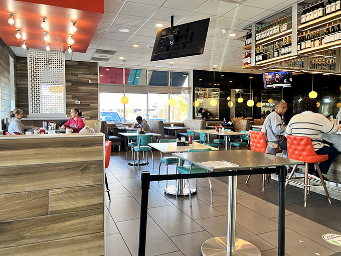 Retro meets modern in this dining space where turquoise chairs and wood accents create the perfect backdrop for your food photography addiction.