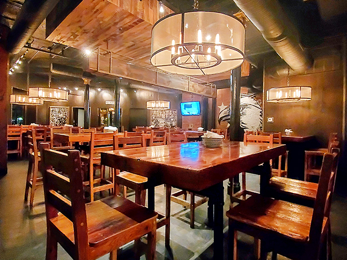 The dining room's warm wooden tables and industrial lighting create an atmosphere where memories are made between bites of Southern goodness.
