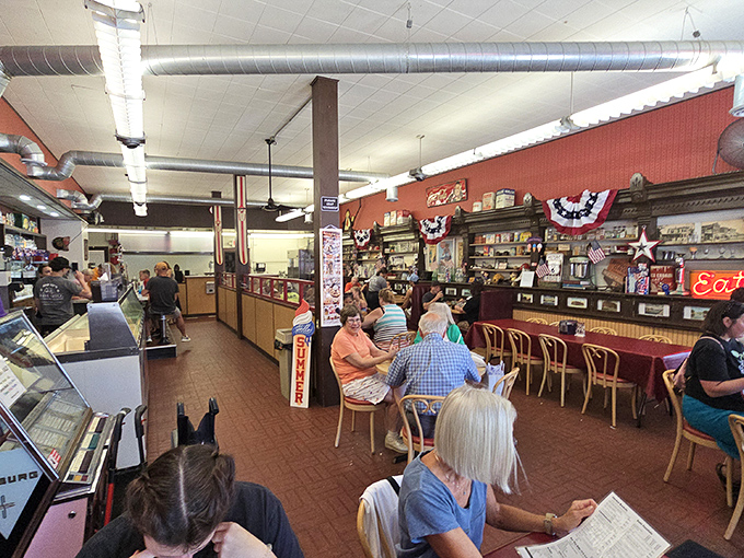 The counter seating isn't just functional&mdash;it's front-row tickets to culinary theater where milkshakes are the headlining act.