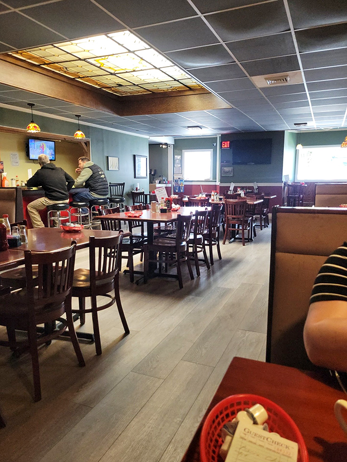 The dining room feels like the community's living room, where the stained glass ceiling fixture serves as both art and conversation starter.