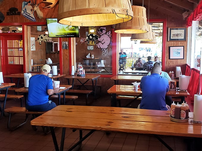 Picnic tables under barrel lampshades&mdash;where strangers become friends united by the universal language of "mmm" and "pass the napkins."