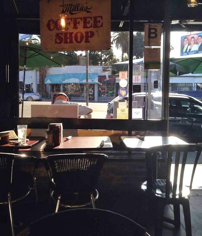 The vintage "Coffee Shop" sign hanging inside reminds you that sometimes the simplest pleasures are the most enduring.