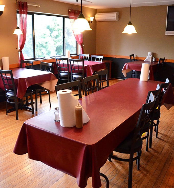 The dining room waits expectantly for the lunch rush. Those pendant lights cast the perfect glow for serious eating business.