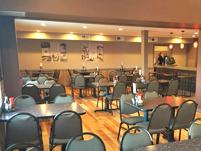 A dining room that balances "nice enough for a special occasion" with "comfortable enough for Tuesday lunch." Wood and warm lighting working overtime.