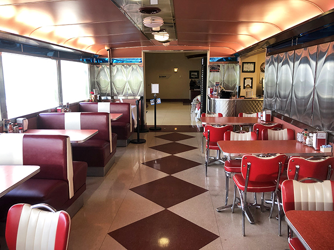 The classic diner interior features that unmistakable checkerboard floor&mdash;where every step feels like you're walking through an episode of Happy Days.