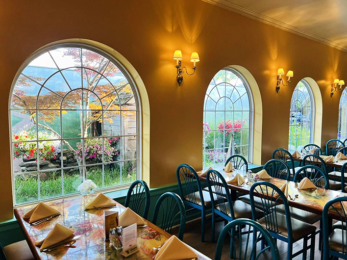 Arched windows flood the dining room with natural light, creating the perfect ambiance for both romantic dinners and strategic buffet planning sessions.