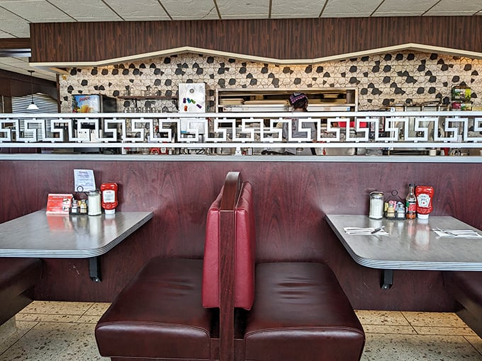 These booths have heard more Pittsburgh secrets than any therapist in town. Red vinyl: the original comfort seating.