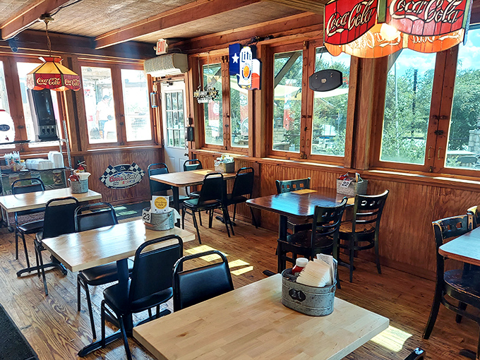 Sunlight streams through windows onto simple wooden tables, creating the perfect stage for the upcoming burger drama about to unfold. 