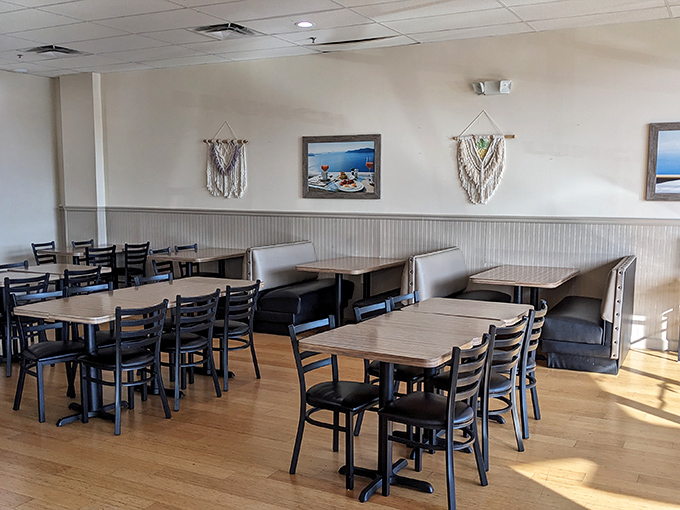 Sunlight streams through windows illuminating booths where breakfast dreams come true. Like Hemingway's clean, well-lighted place, but with pancakes.