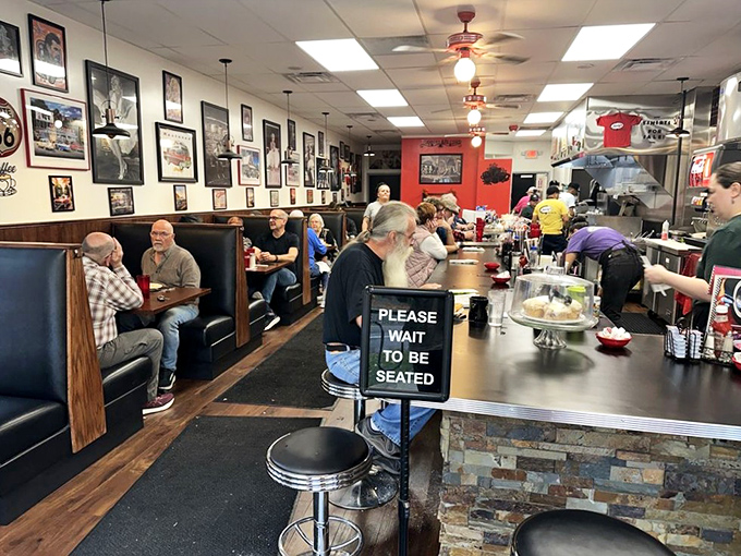 The dining area hums with the symphony of forks against plates and conversation, where "Please Wait to Be Seated" means good things come to those who wait.