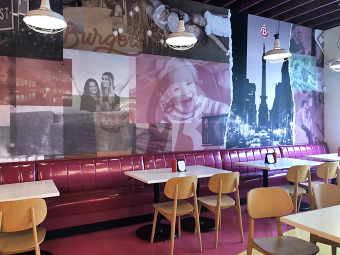 The dining area's pink booths and vintage-inspired wall art create the perfect backdrop for both your meal and your inevitable Instagram story.