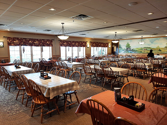 The dining room waits patiently between rushes, Windsor chairs standing at attention like soldiers guarding the gateway to comfort food heaven.