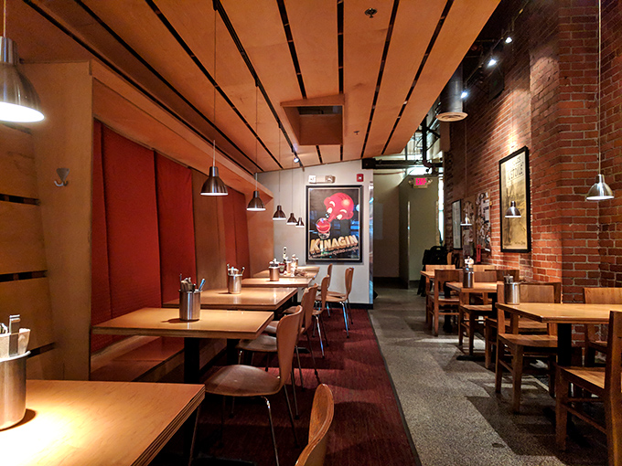 Dining spaces that whisper "stay awhile" rather than shouting "turn tables quickly." Note the wood, brick, and lighting that flatters everyone.