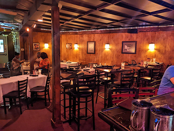 The dining room whispers of countless celebrations past, where wood beams and soft lighting have witnessed decades of "special occasion" memories.