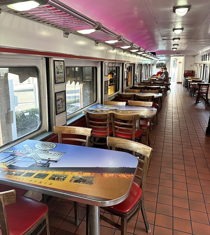 Dining car design 101: Simple tables, wooden chairs with red seats, and windows perfect for people-watching on Sunset while you contemplate a second chili dog.