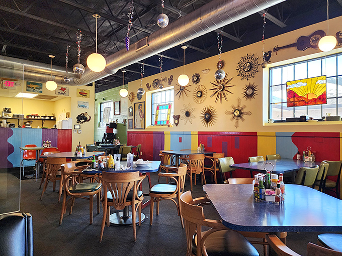The dining room feels like your most interesting friend's kitchen&mdash;if that friend collected cosmic art and really understood good lighting.