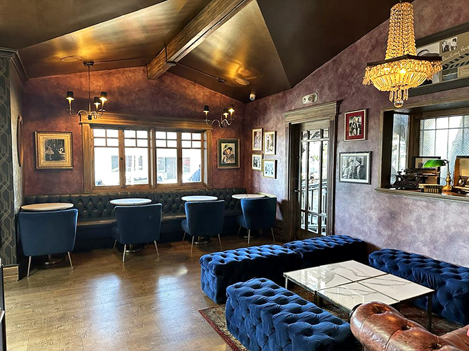 The lounge area's blue velvet seating and crystal chandelier create the living room you wish you had &ndash; minus the remote control arguments.