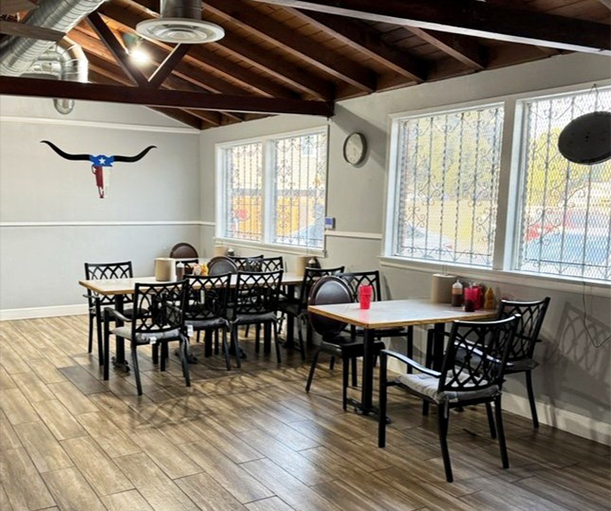 Simple tables, wooden beams, and a longhorn on the wall&mdash;Texas isn't just in the name, it's in every inch of this welcoming space.