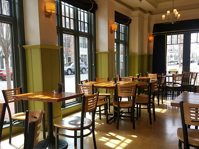 Sunlight streams through tall windows, creating natural spotlights on wooden tables that have witnessed countless first dates, celebrations, and Tuesday lunch escapes. 