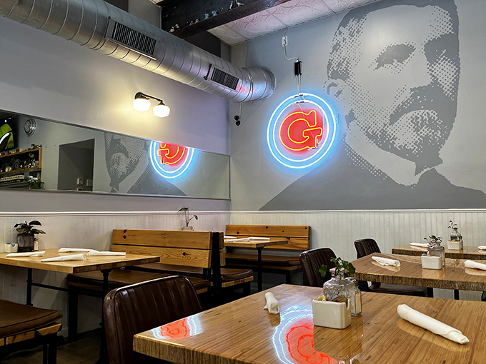 Modern meets nostalgic in this dining space where neon signs cast a glow that says, "Yes, you've found somewhere special."