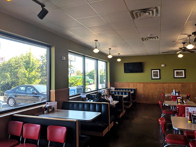 The dining area feels like it was designed by someone who understands that comfort trumps trendiness every time. Those booths have heard some stories.