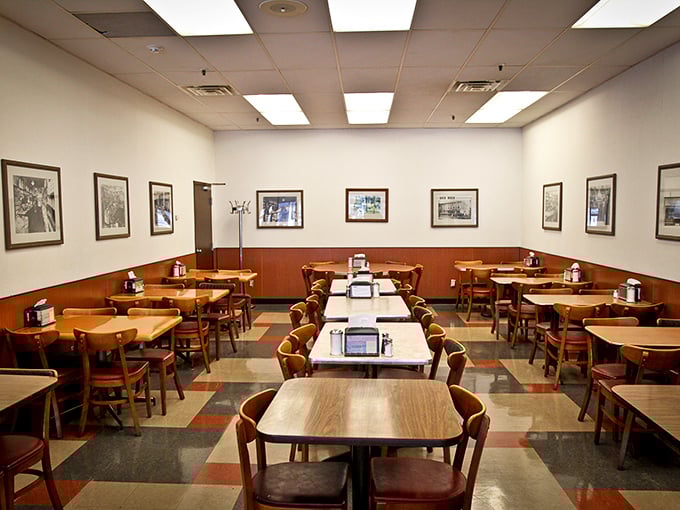 The quieter dining section where deals are made and memories created. Those framed photos on the walls tell stories of Indianapolis through the decades.
