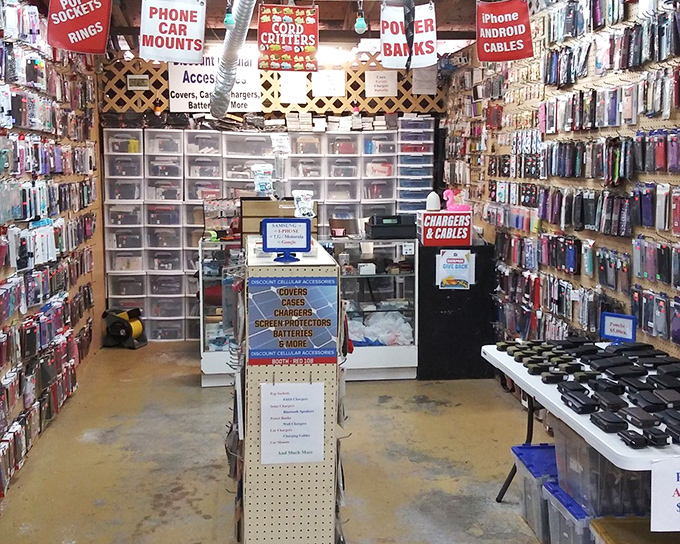 The tech booth&mdash;where yesterday's cutting-edge gadgets meet today's necessities, proving that even in paradise, we can't escape our need for phone chargers.