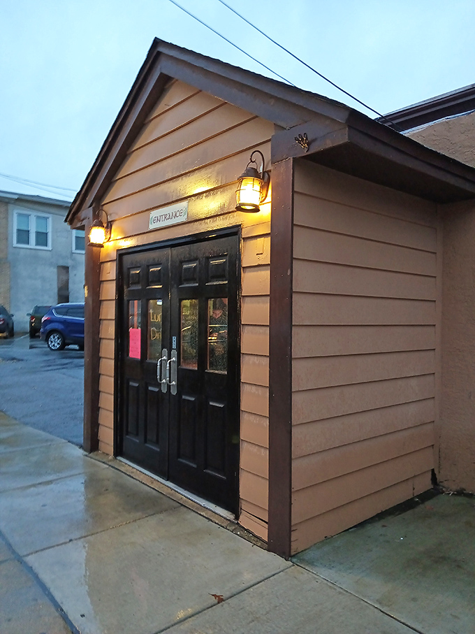 The entrance beckons with warm lighting and the promise of good times. Like a lighthouse guiding hungry sailors to shore.