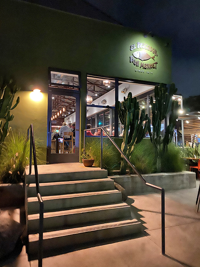 As night falls, El Pescador's warm glow beckons like a lighthouse for the hungry, promising safe harbor for seafood lovers.