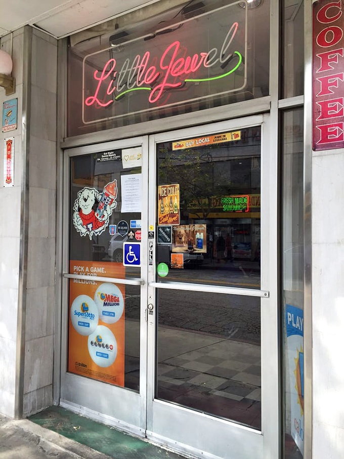 That neon sign beckons like an old friend. "Little Jewel" glowing pink against the night, promising delicious memories just beyond those doors.