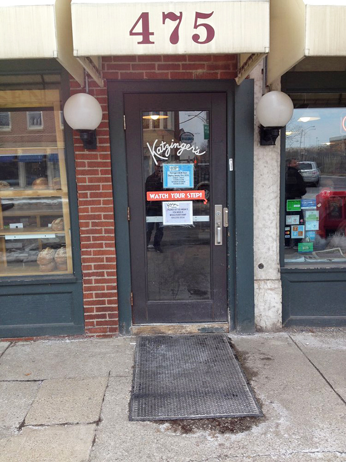 The entrance at 475 &ndash; where the "Watch Your Step" sign might as well add "&hellip;into sandwich paradise."