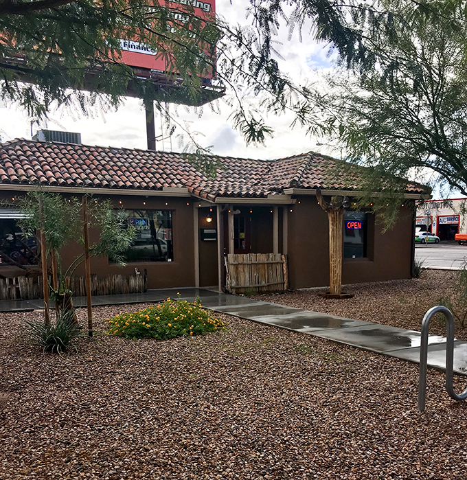The desert-inspired landscaping and terracotta-colored building blend perfectly into Phoenix's aesthetic, like it grew naturally from the Arizona soil.