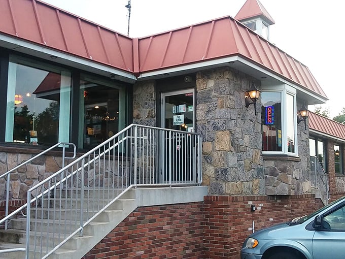 Stone walls and copper roofing say "we've been here a while and plan to stay." The steps practically beckon you inside.