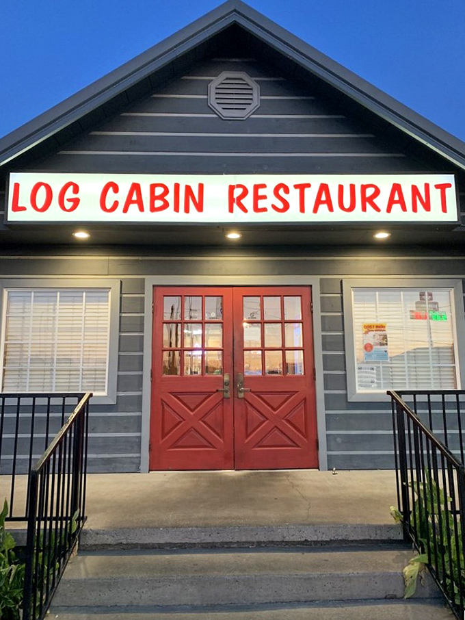 As night falls, those red doors glow like the entrance to a Southern food sanctuary. Password: "I'm hungry."