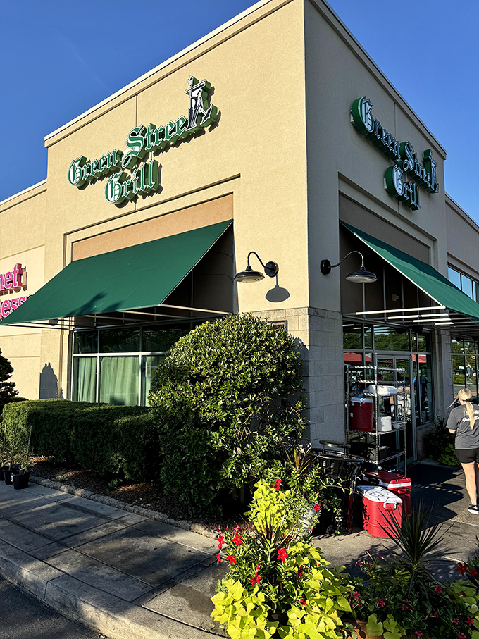 The cream-colored exterior with emerald green signage stands as a beacon for hungry travelers and locals alike.