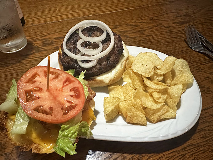 Not just a burger&mdash;a masterclass in proper beef-to-bun architecture. Those crispy chips on the side are just showing off at this point.