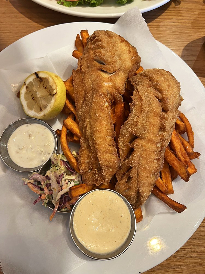 Fish and chips that would make a British pub jealous. The golden batter shatters with each bite like delicious edible glass.