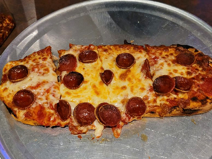 Even the pizza holds its own in this hot dog haven. When a side dish refuses to be upstaged, you know you're somewhere special.