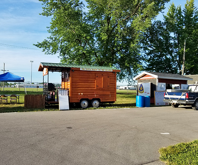 A rustic wooden food cart awaits the morning rush. Simple structures like these house some of the most memorable market flavors.