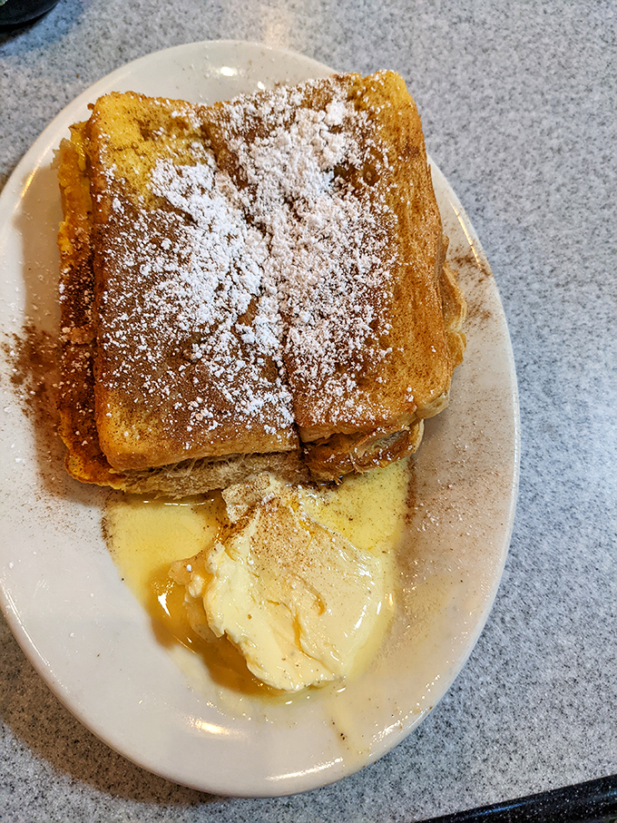 French toast that's dressed for success with a snow-like dusting of powdered sugar. Breakfast or dessert? The line deliciously blurs.