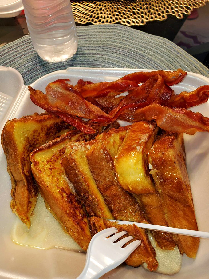 French toast that's achieved custardy perfection inside while maintaining that caramelized exterior&mdash;topped with bacon that's clearly been on speaking terms with the griddle.