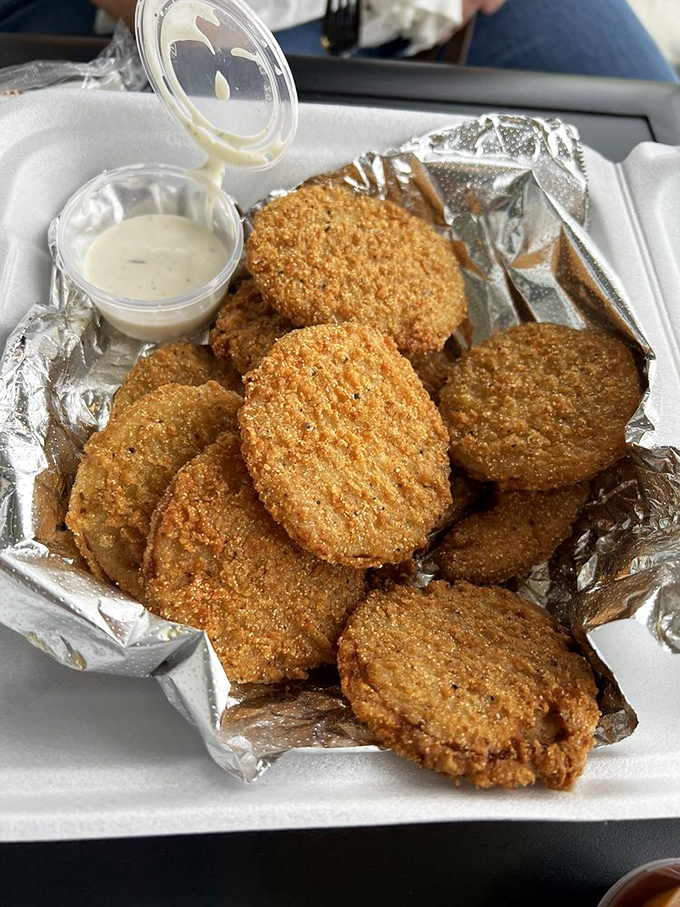 Fried green tomatoes with ranch dipping sauce&mdash;the South's answer to mozzarella sticks. Crispy, tangy, and utterly addictive.