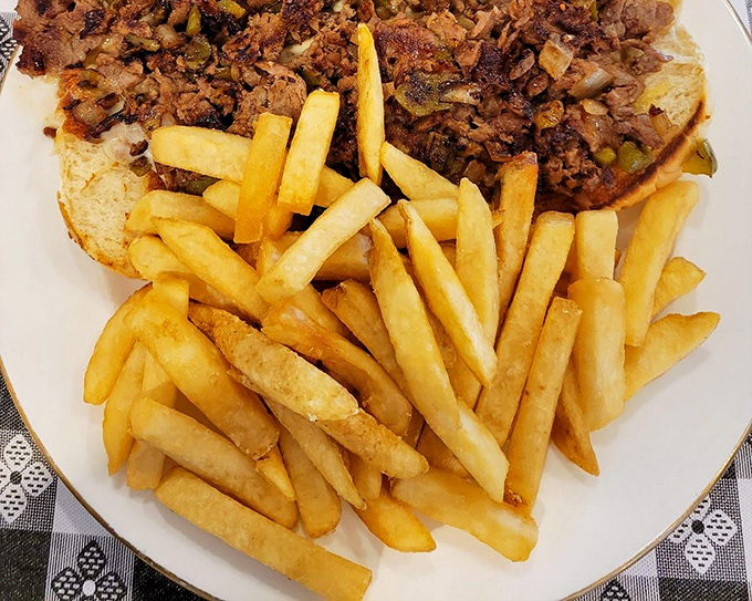 A sandwich that could feed a small militia, paired with fries so perfectly golden they deserve their own Instagram account.