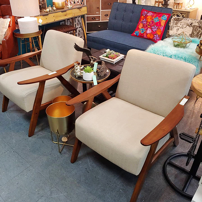 Mid-century modern heaven in cream and wood tones. Don Draper would fight you for these pristine armchairs.