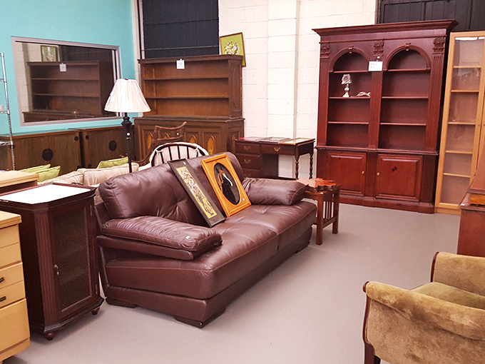 Rich wood tones and leather upholstery create a sophisticated furniture tableau that would make Ron Burgundy declare it "kind of a big deal."