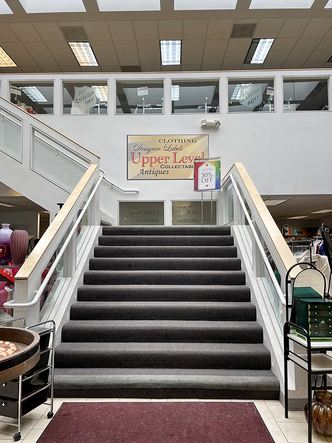 The grand staircase beckons shoppers to the "Upper Level" &ndash; where designer outlet finds and collectibles await the truly dedicated treasure hunter.
