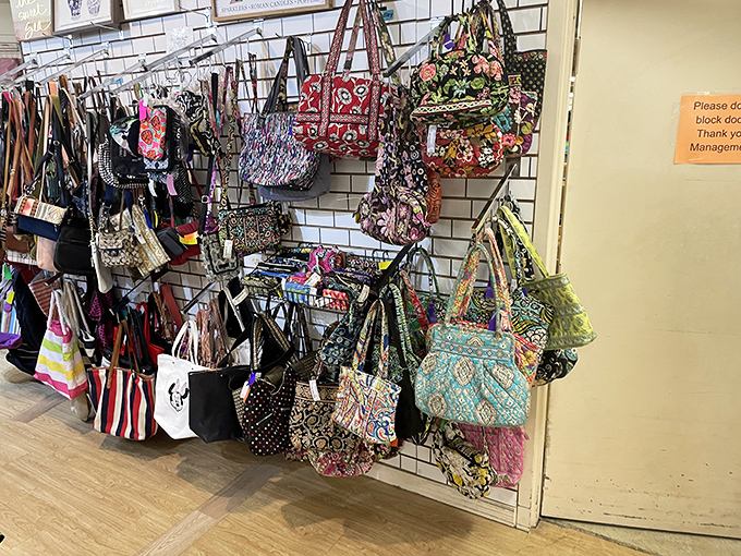 The handbag wall&mdash;a kaleidoscope of patterns and colors where Vera Bradley meets vintage finds in a fashionable conversation.
