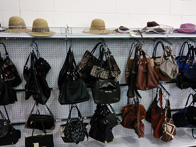Handbag heaven with a hat garnish! Designer lookalikes and genuine finds hang together in democratic fashion harmony.