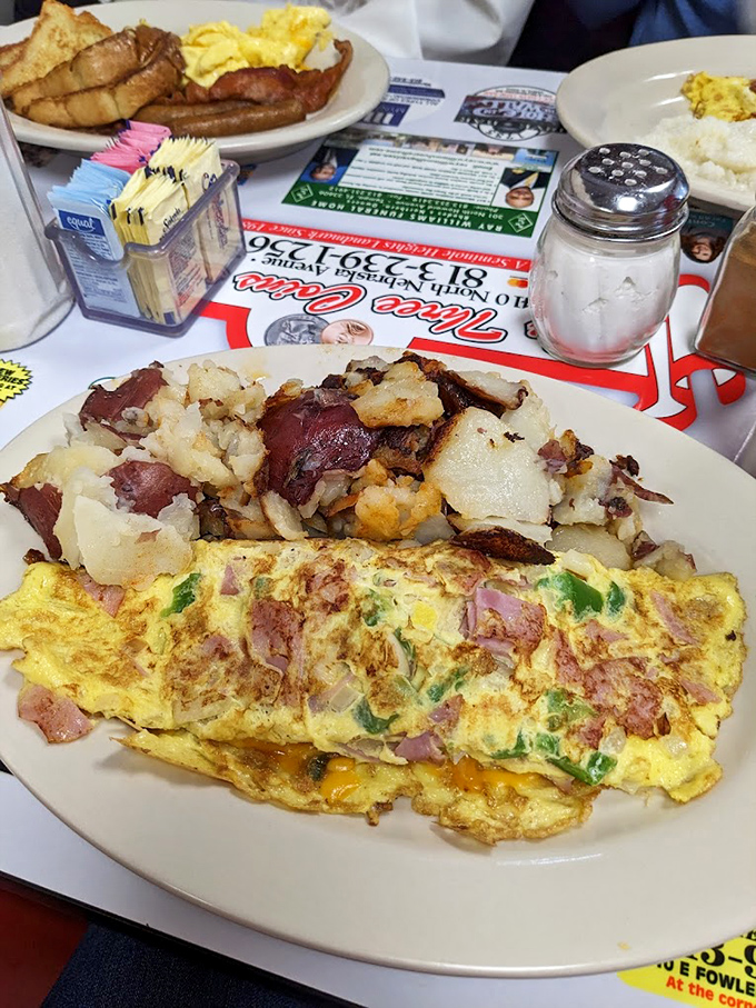 This veggie omelet with hash browns proves that "healthy choice" doesn't have to mean "taste sacrifice" in the diner universe.